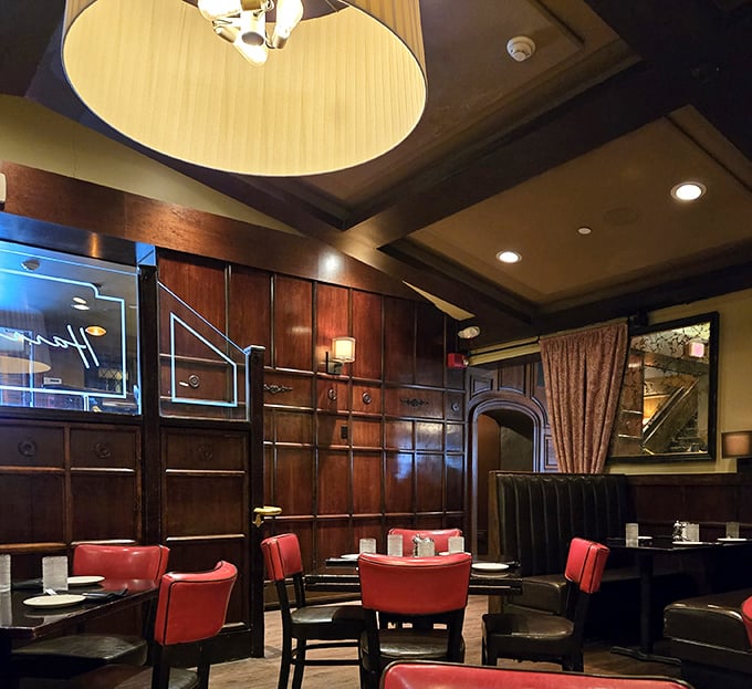 Rich mahogany panels and red leather seating create the perfect backdrop where carnivorous dreams become delicious reality every single night.