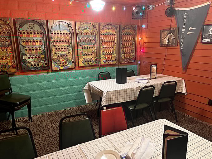 Vintage pinball backboards line the walls of this quirky dining room, where checkered tablecloths and string lights create an atmosphere that's equal parts nostalgic and magical.