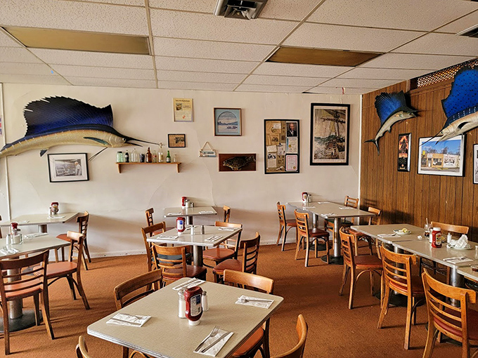 Where mounted marlins keep watch over diners enjoying Detroit's finest fish and chips in a no-frills setting that feels like culinary time travel.
