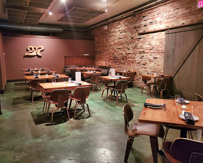 Industrial meets intimate in this dining space where exposed brick walls tell stories while wooden tables invite you to create your own. Rustic elegance at its finest.