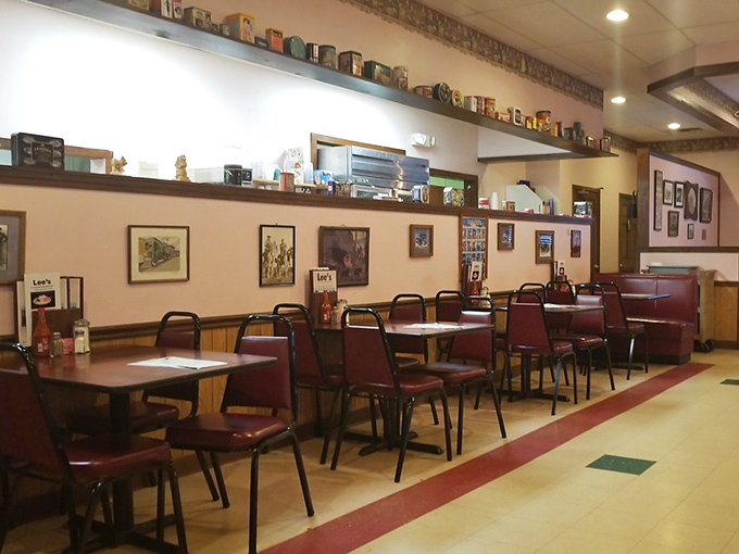 Classic Americana lives in these burgundy booths and vintage collectibles. The dining room feels like a time capsule where comfort never goes out of style.