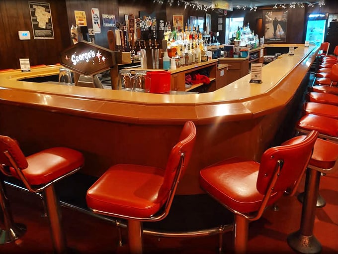 Pull up a cherry-red stool at this classic curved bar where stories flow as freely as the drinks. The wood-paneled walls have witnessed decades of Canton celebrations and commiserations.