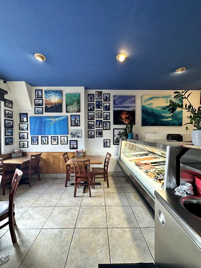 Ocean-blue ceiling, surf photography, and a gleaming seafood counter&mdash;this isn't decoration, it's a mission statement. Simplicity with purpose, like a perfectly grilled fish.