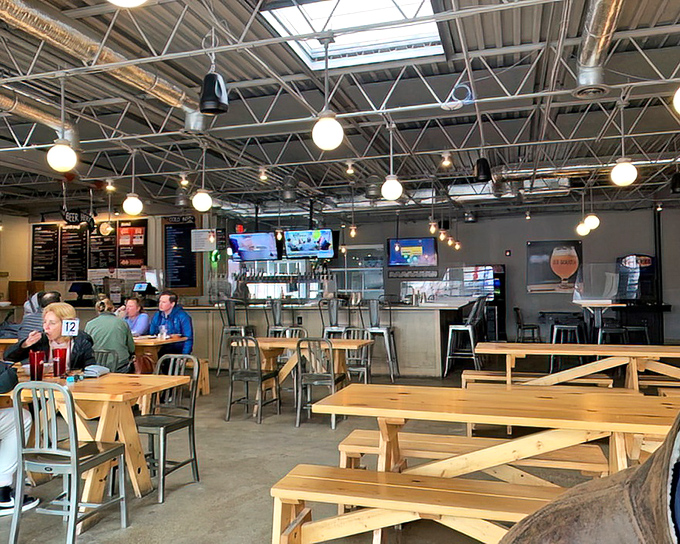 Industrial-chic meets Midwest hospitality inside, where communal tables invite strangers to become friends over shared pizza revelations.