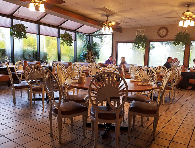 Sunlight streams through windows illuminating those iconic sunburst chairs&mdash;the unofficial thrones of breakfast royalty at Dino's.