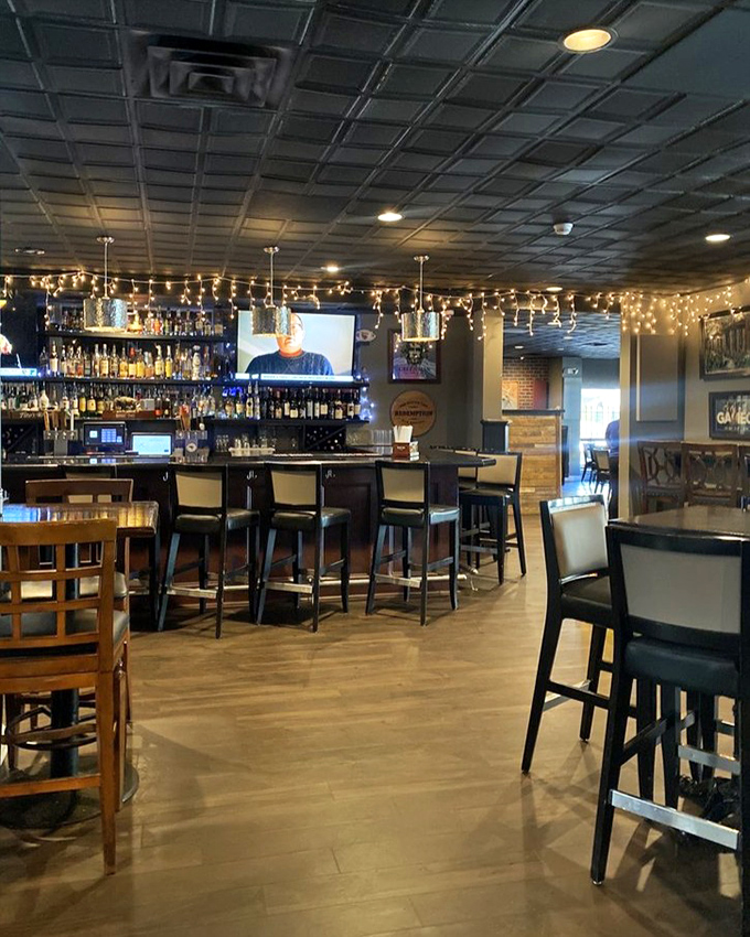 The bar gleams with promise while string lights create that "you've arrived somewhere special" atmosphere that makes everyday dining feel like a celebration.