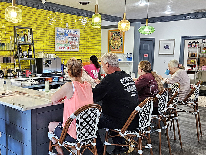 That vibrant yellow brick wall isn't just a design choice&mdash;it's a beacon of breakfast hope for hungry patrons perched at the counter.