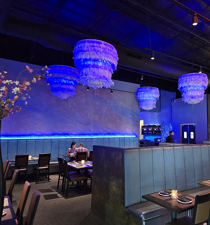 Step inside and the blue-hued interior with feathery chandeliers creates an atmosphere that's both sophisticated and playful&mdash;fine dining without the stuffiness.