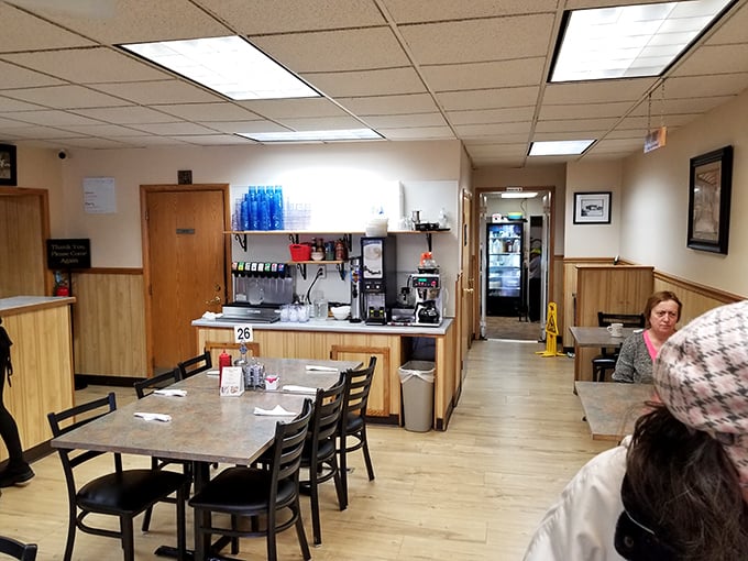Simple wood paneling and no-nonsense tables create the perfect backdrop for serious breakfast contemplation and coffee refills.