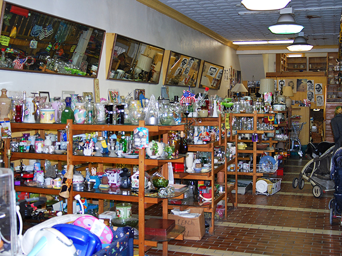 Wooden shelves bursting with glassware and knickknacks create a treasure hunter's paradise where one person's castoffs become another's prized possessions.