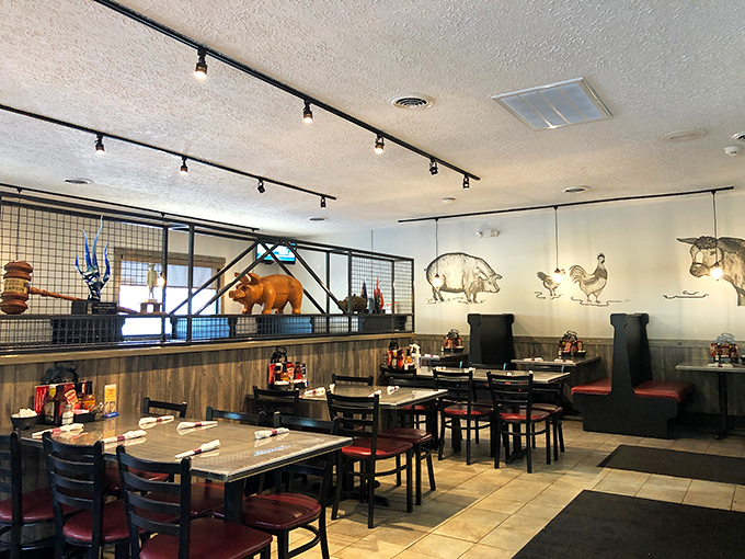 Animal silhouettes on the wall serve as a delicious menu in pictograph form. The wooden wainscoting adds warmth that matches the smoky aromas. 