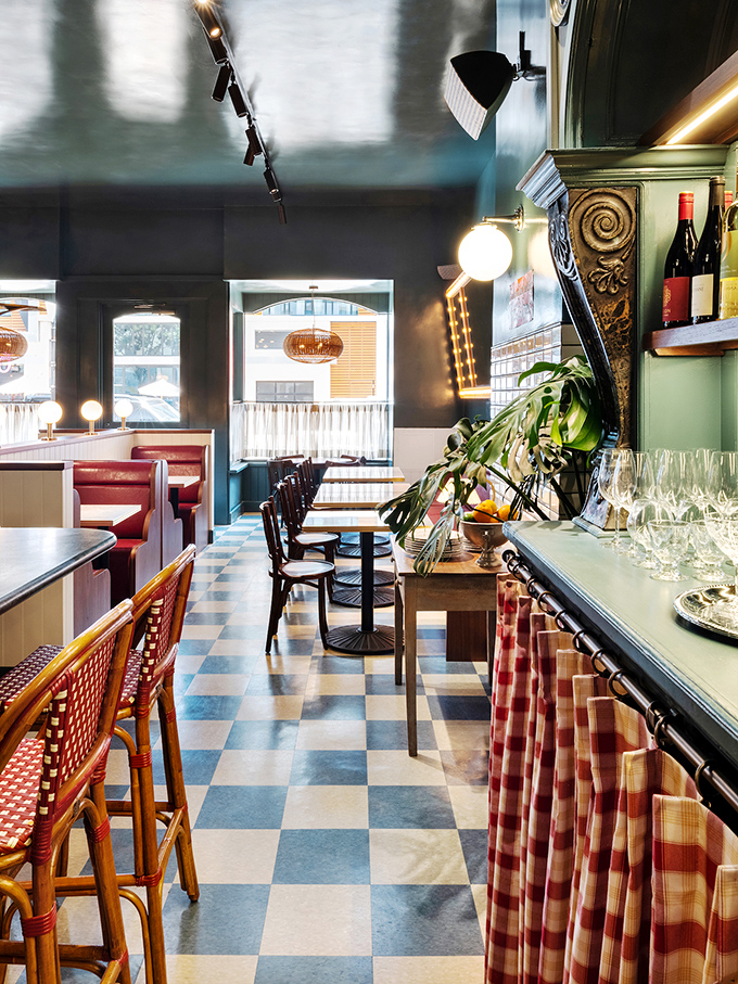 Checkerboard floors, red banquettes, and warm lighting create the perfect setting for your French food fantasies. It's like Paris decided to vacation in San Diego and never left.