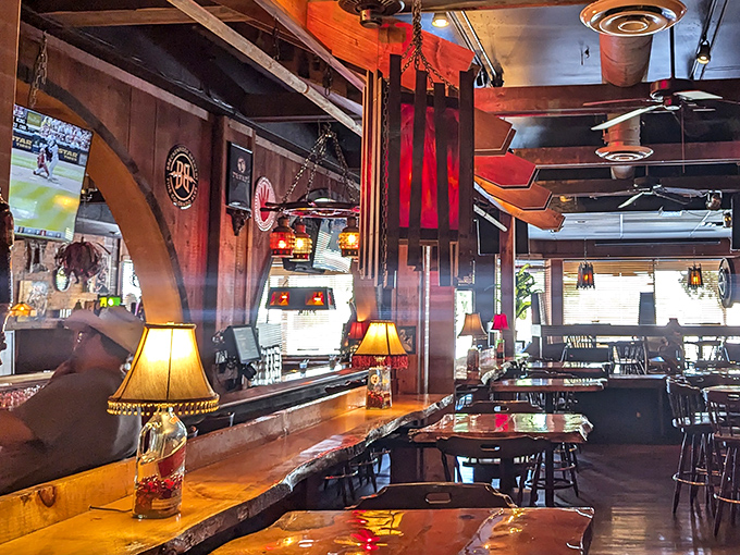 Step inside and you're transported to a warm wooden wonderland where table lamps cast a golden glow and conversations flow as freely as the drinks.