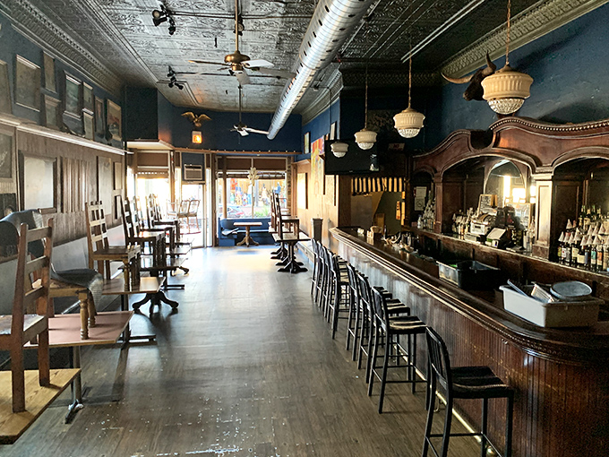 Step inside and the honky-tonk vibe is immediate &ndash; that gorgeous wooden bar, tin ceiling, and warm lighting create the perfect backdrop for serious meat appreciation.