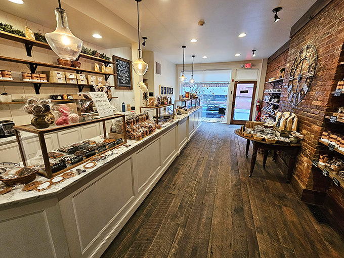 Rustic wooden floors and exposed brick walls frame a treasure trove of confectionery delights awaiting discovery.