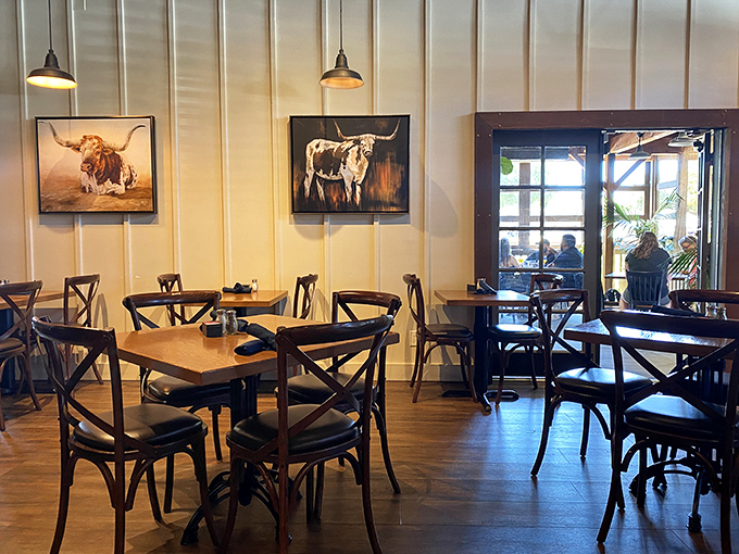Step inside and you're greeted by rustic elegance that says "we take our steaks seriously." Longhorn artwork watches over diners like benevolent bovine guardians.