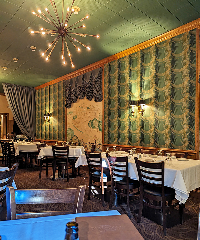 Mid-century elegance meets timeless comfort. Those seafoam green drapes and sputnik chandelier aren't retro&mdash;they're original. This room has witnessed more celebrations than a wedding DJ.