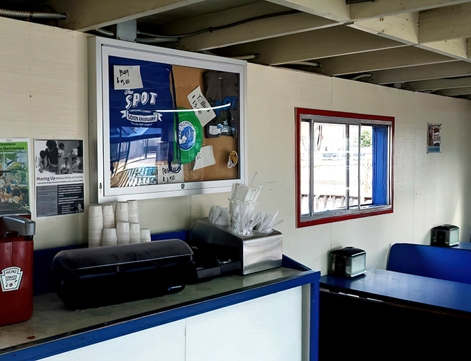 No-frills interior where culinary magic happens. The ordering window might be simple, but the flavors coming from behind it are anything but.