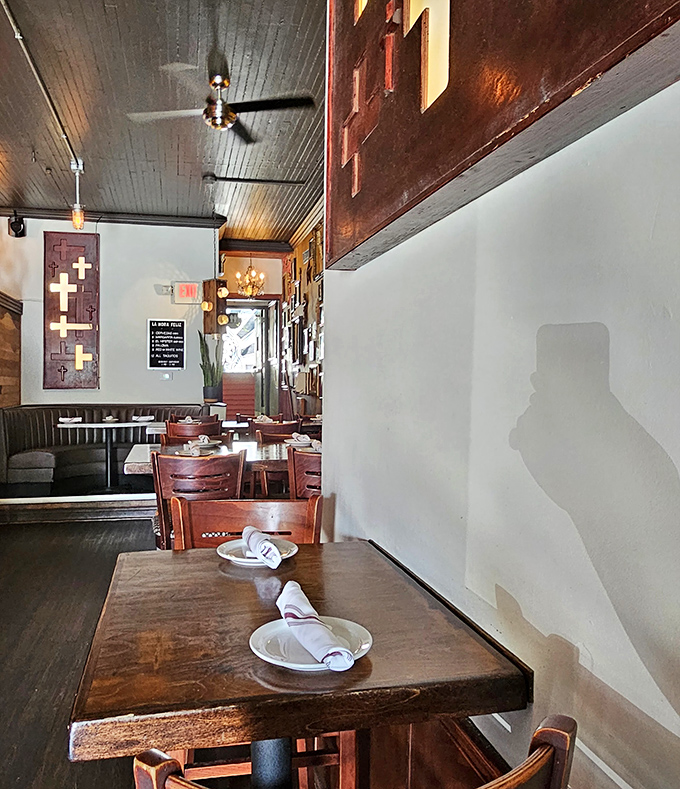 Inside, rustic wooden tables and religious iconography create an atmosphere that's both reverent to tradition and coolly contemporary.