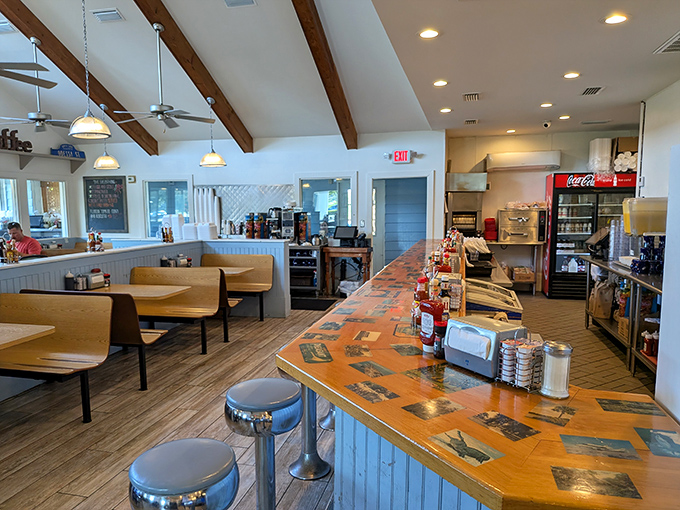 Inside, wooden beams and cozy booths create that perfect "I could stay here all morning" vibe. The counter practically whispers, "Pull up a stool, friend."