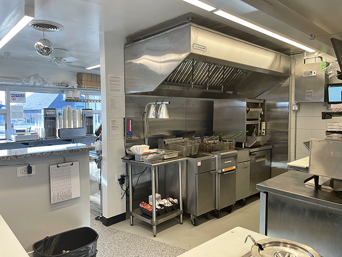 Behind the scenes at Buddy's, where stainless steel gleams with purpose and every spatula flip is performed with the precision of a culinary ballet.