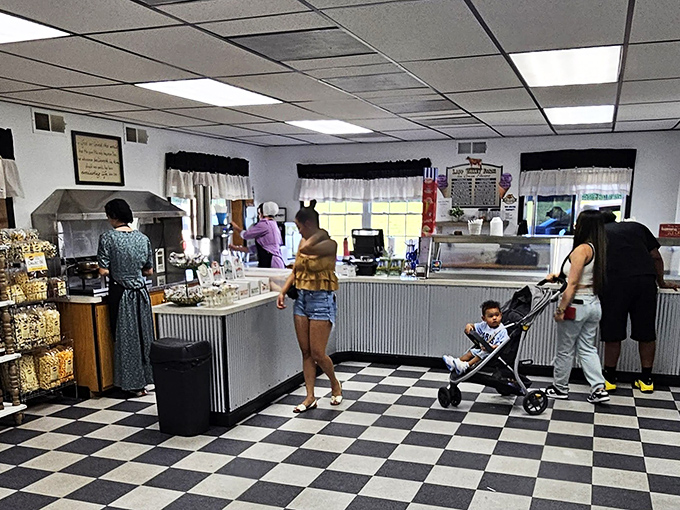 The classic black and white checkered floor sets the stage for ice cream magic, where Amish craftsmanship meets dairy perfection.