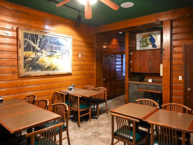 Warm wooden walls and green ceiling create a cozy cabin vibe that feels like the perfect hideaway for seafood lovers seeking refuge from the ordinary.