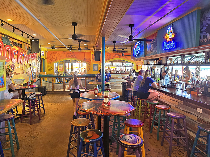 Inside Frenchy's, the vibrant colors and beach-bar energy create the perfect backdrop for that "I'm officially on vacation" moment we all crave.