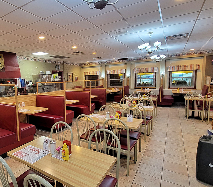 Treasure hunting begins here, where colorful banners hang like festival flags above a sea of carefully organized clothing racks waiting to be explored.