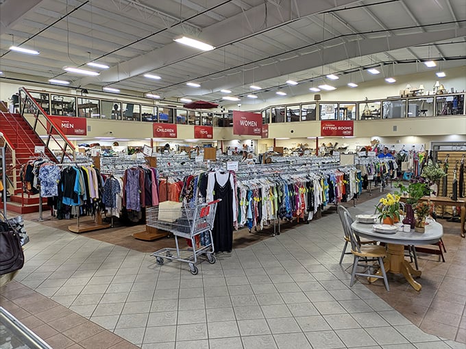 A thrifter's paradise unfolds inside with meticulously organized racks stretching as far as the eye can see. Shopping nirvana awaits!