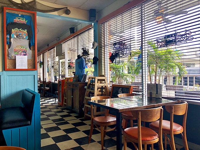 Classic Florida charm comes alive with turquoise paneling and checkered floors &ndash; the kind of authentic beach joint where memories are made between bites. 