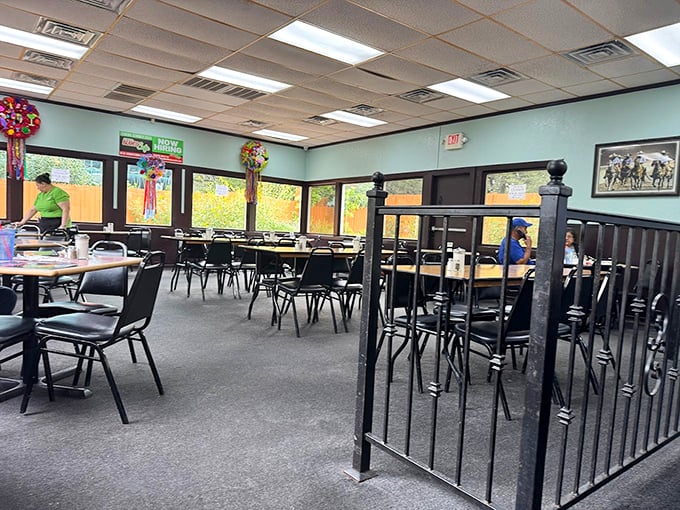 Simple mint-green walls and practical seating tell you everything: this place prioritizes flavor over frills. The piñatas are just a bonus.