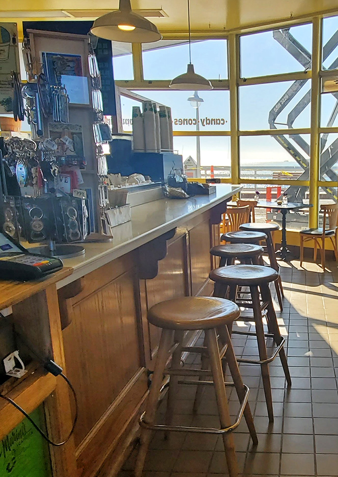 Wooden stools by panoramic windows—the perfect perch for ice cream contemplation while watching waves crash against the Santa Cruz shore.
