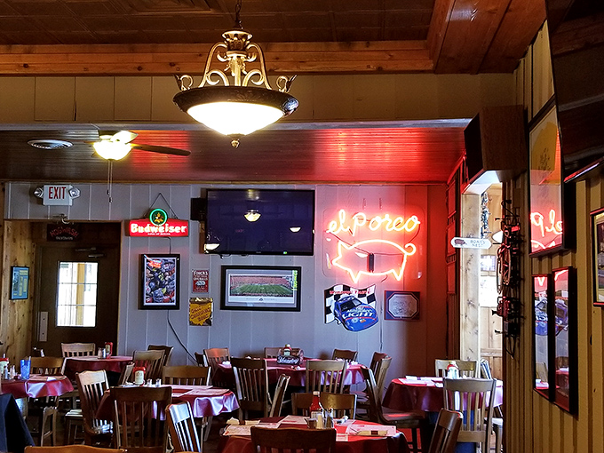 That neon pig sign isn't just decoration—it's a beacon of hope for the hungry and a promise of smoky delights to come.