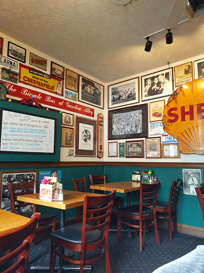 Every wall tells a story in this automotive wonderland where nostalgia meets exceptional comfort food.