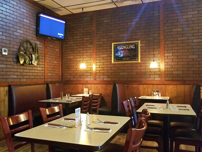Cozy booths and exposed brick walls create the perfect backdrop for BBQ bliss. No white tablecloths needed when the food is this good.