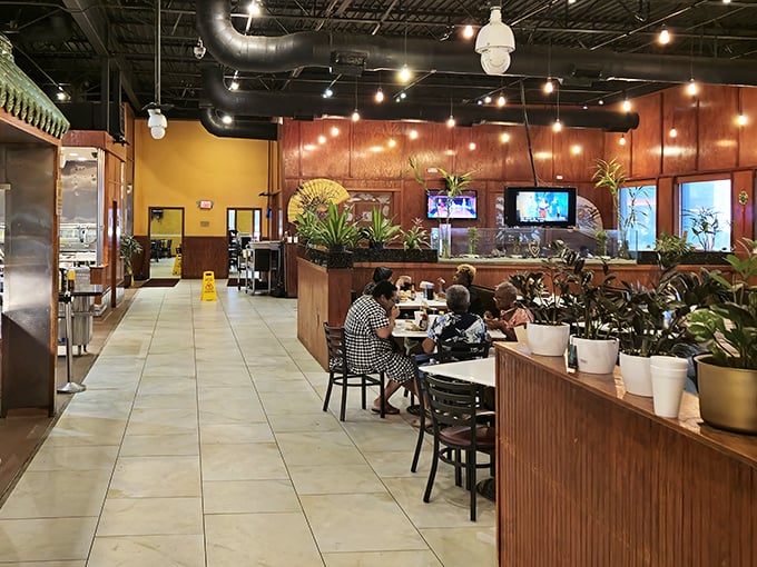 Warm wood tones and potted plants create an inviting atmosphere where comfort meets casual dining. The perfect setting for serious eating.