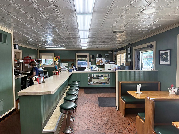 Where barbecue magic happens. The pressed tin ceiling and green paneling have witnessed decades of "mmms" and "aahs" from satisfied diners.