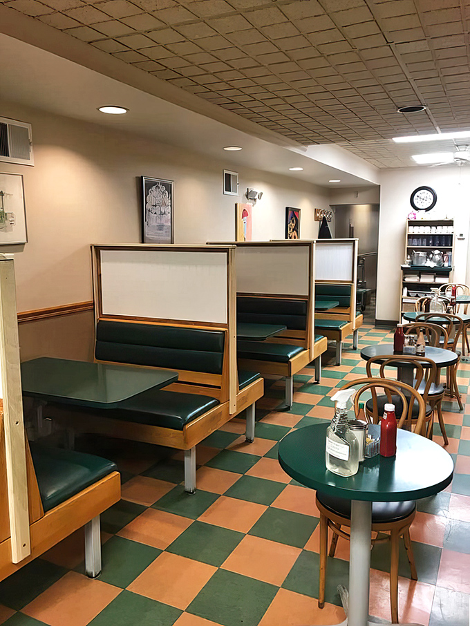 Classic diner aesthetics with those unmistakable green and orange checkerboard floors. Sliding into these booths feels like time travel.