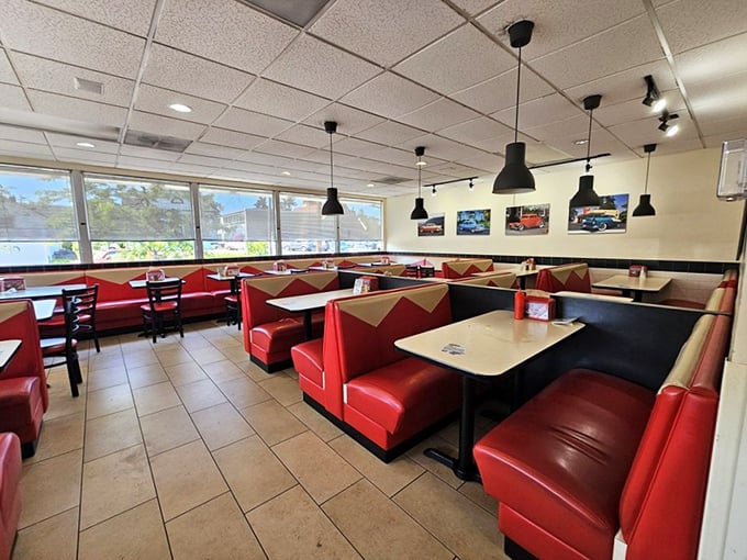 Red vinyl booths and vintage car photos transport you to simpler times when conversations happened face-to-face, not screen-to-screen.