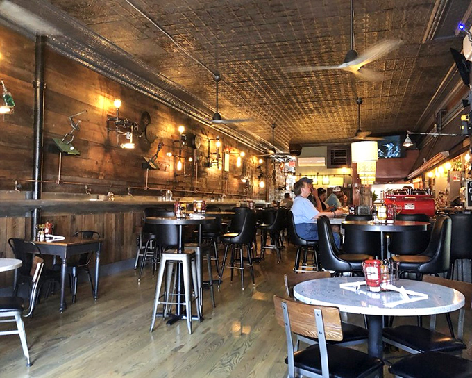 Step inside and discover rustic-industrial perfection &ndash; pressed tin ceilings, warm wood paneling, and lighting that makes everyone look like they're starring in their own food documentary.