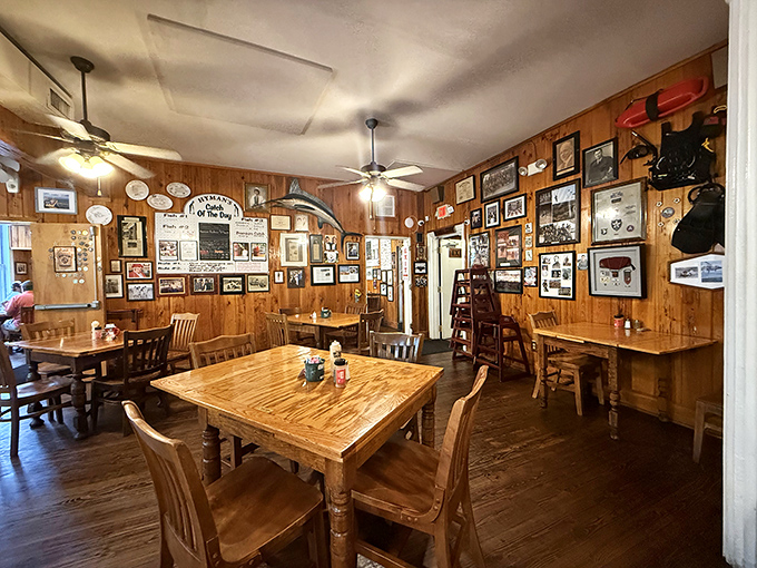 Wood-paneled walls covered in memorabilia create a museum-like dining room where every table tells a story and every meal becomes a memory.