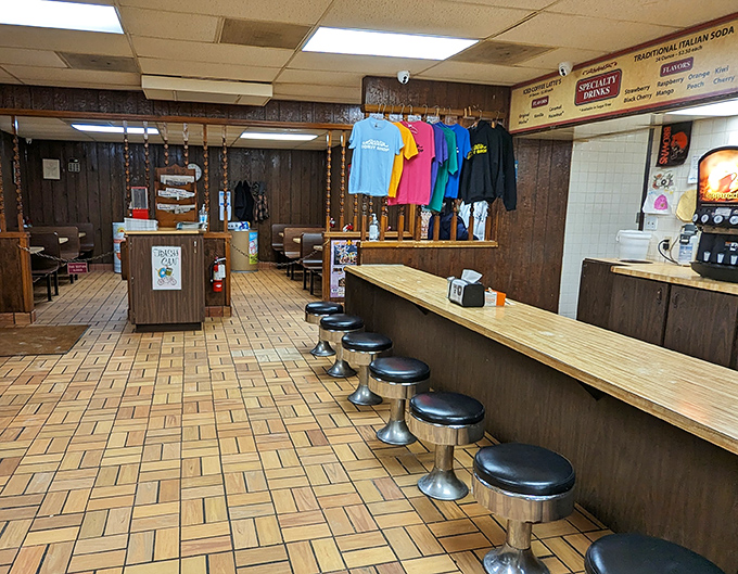 Step inside and time stands still &ndash; wood paneling, swivel stools, and the promise of handcrafted donuts that would make Homer Simpson weep with joy.
