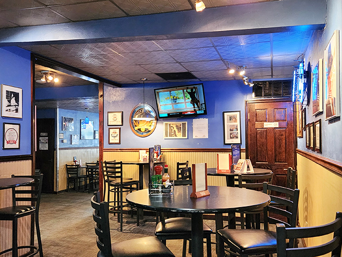 Blue walls adorned with memorabilia create that perfect "come as you are" atmosphere where comfort meets character in every corner.