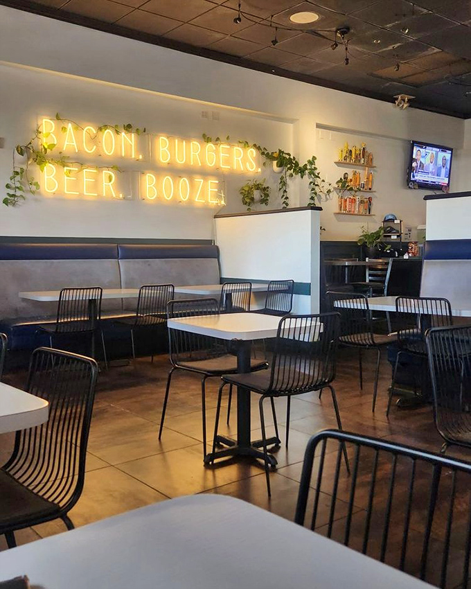 The neon doesn't lie. Four essential food groups illuminated for your dining pleasure, with greenery adding a touch of "see, we're not completely unhealthy!"