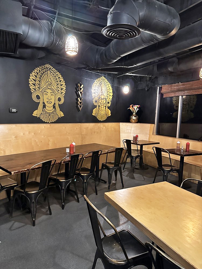 Gold Filipino-inspired artwork adorns dark walls while industrial-chic metal chairs invite you to sit and stay awhile. No white tablecloths needed when the food does the talking.