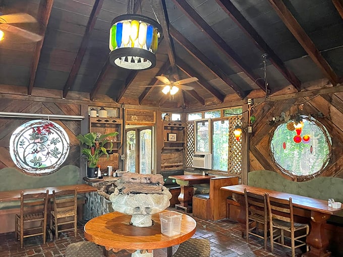 Step inside and time slows down &ndash; circular stained glass windows cast kaleidoscope patterns across rustic wooden tables in this magical dining space.