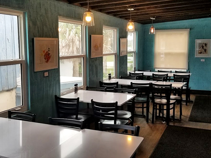 Inside, the soothing coastal blues and simple furnishings create that rare, authentic Florida vibe—like dining in a friend's beach house rather than a restaurant.
