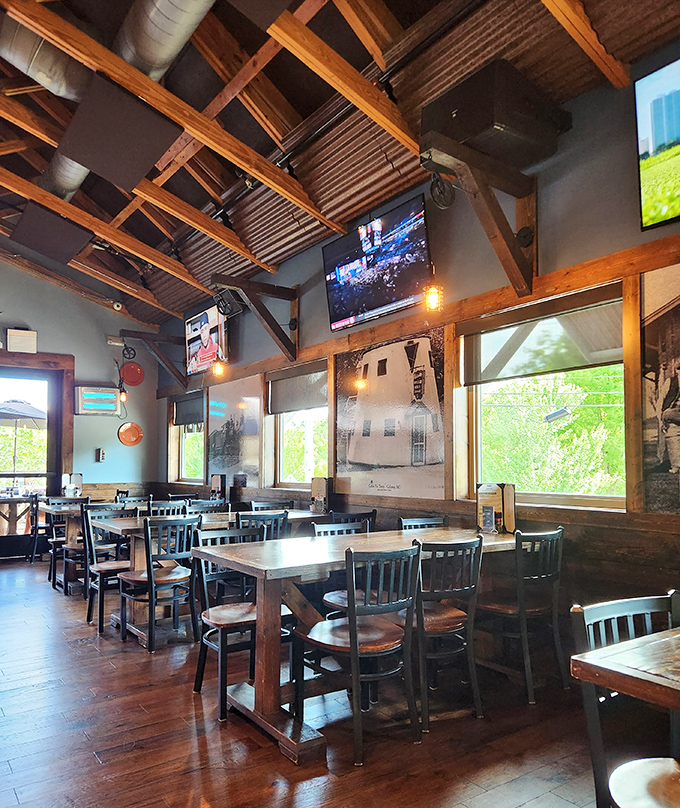 Rustic wooden beams frame the dining experience, creating that perfect "fancy cabin" vibe where comfort meets class without an ounce of pretension.