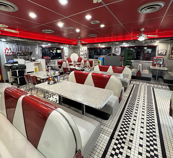 Step inside and you're transported to a bygone era where red vinyl booths, chrome accents, and checkerboard floors create the perfect backdrop for comfort food conversations.